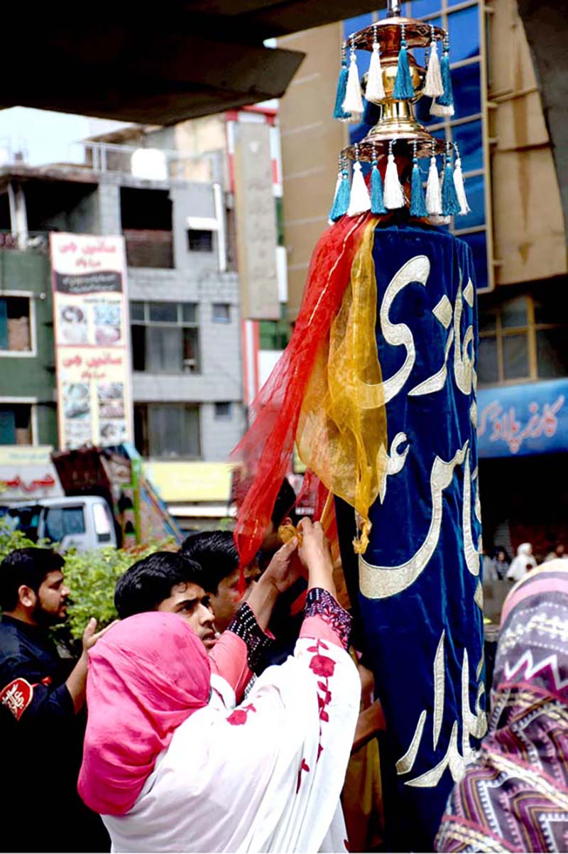 Mourners touch the Zuljinah (Symbolic Horse) during the 10th Muharram ...