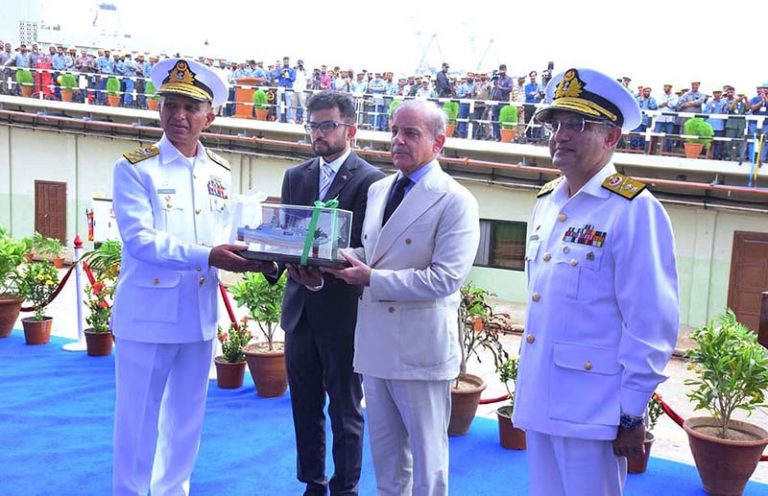 Chief of Naval Staff Admiral Muhammad Amjad Khan Niazi presenting a ...
