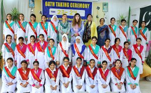 Principal Prof. Dr. Fariha Nighat in a group photograph with students during oath taking ...