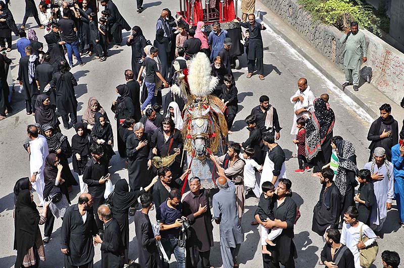 A large number of mourners attending the Chehlum procession to ...
