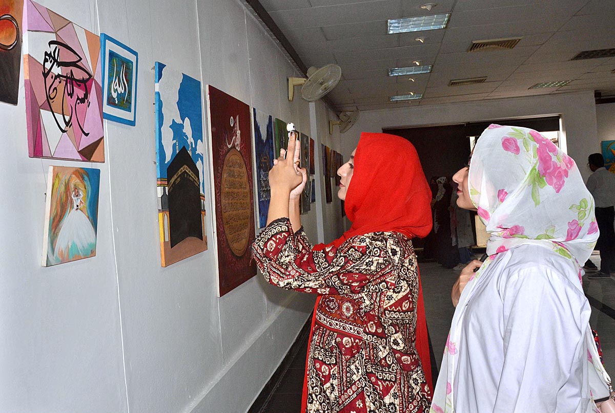 Visitors taking a keen interest in calligraphy and Sufism exhibition at ...