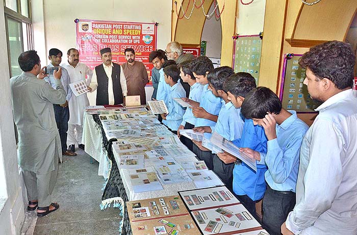 Postman busy in his work on the occasion of World Post Day at the GPO.