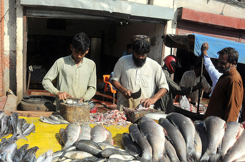 Vendors are selling and cutting fish as its demand increased despite ...