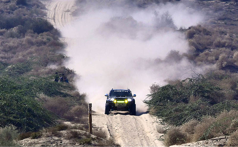 Racer showing his skills in the final round of the 8th Thal Desert Jeep ...