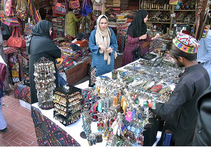 Artists performing traditional dance during “Folk Festival Lok Mela” at ...