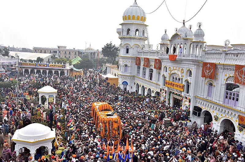 A large number of Sikh yatrees performing their religious rituals on the occasion of 554th birth ...