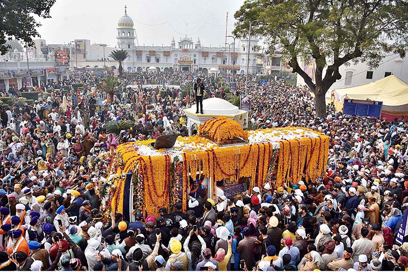 A large number of Sikh yatrees performing their religious rituals on the occasion of 554th birth ...