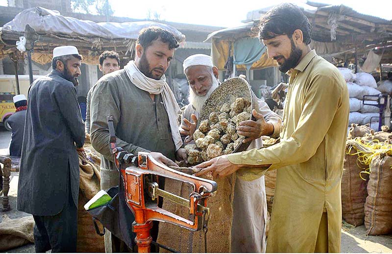 Vendors busy in filling sacks with traditional sweet ‘Gur’ for selling ...