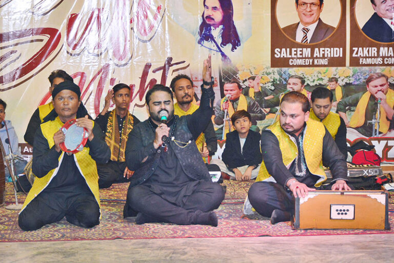 Singers performing Qawali on stage during Sufi night at Mehran Art Council.