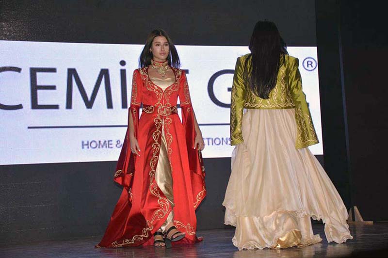 Models presenting the dresses designed by Turkish designer Cemile Gul ...