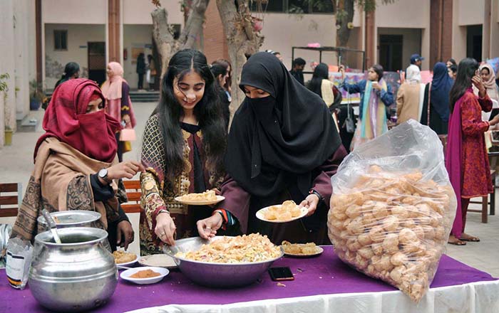 Students enjoying different saltish food items from a stall during ...