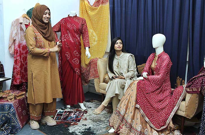 A student viewing creative work during Annual 18th Degree Show at SABS ...
