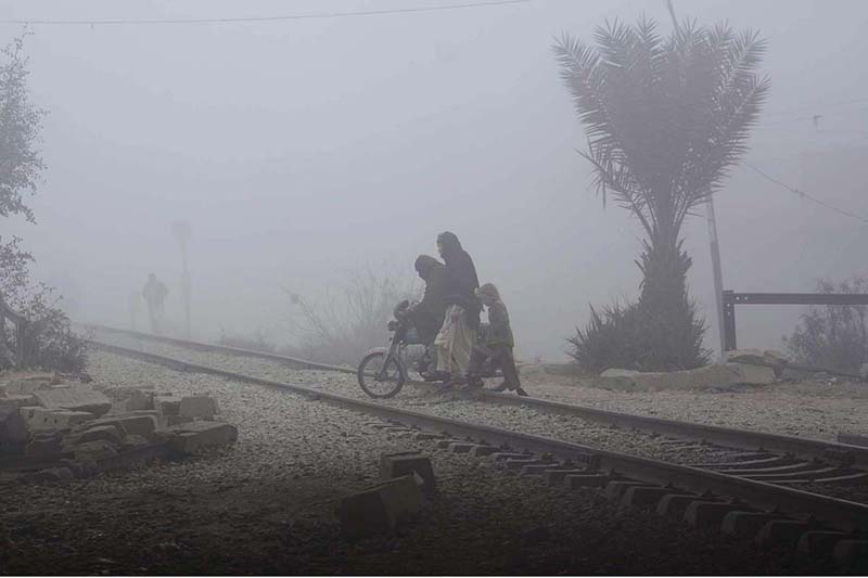 A view of thick fog that engulfs the whole city during morning time in ...