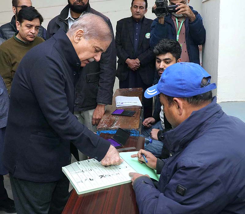 PML-N President Shehbaz Sharif giving thumb impression on ballot paper ...
