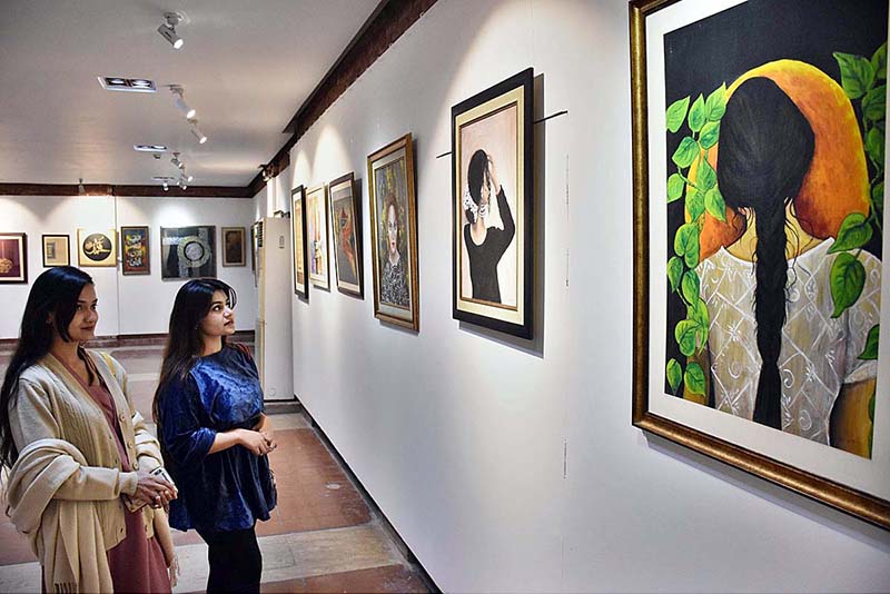 Visitors viewing the displayed stuff during Painting, Sculpture ...