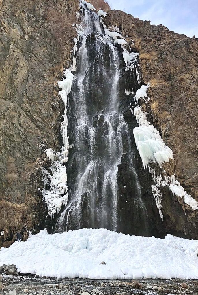 An attractive and eye catching view of freezed Manthoka water fall in ...
