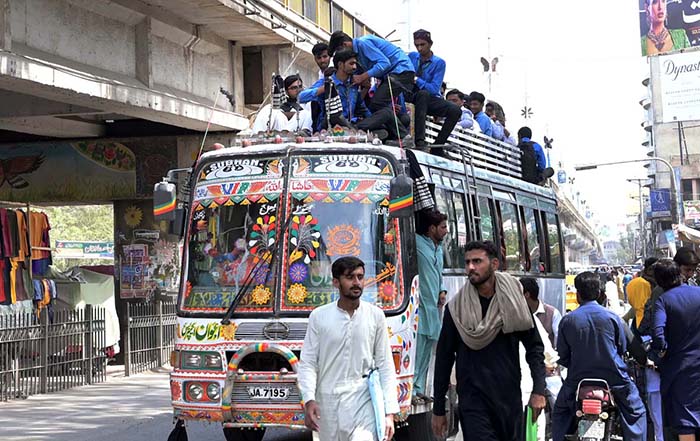 Students sitting on the roof of bus in a dangerous way may cause any ...