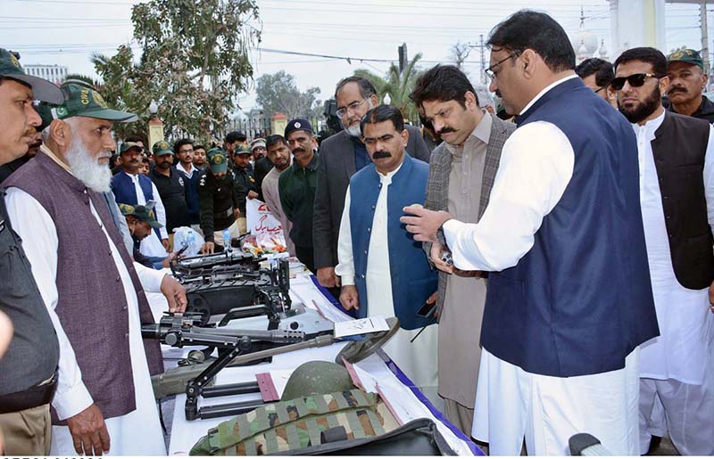 Members of the Boy Scouts and students participating in a walk to mark ...