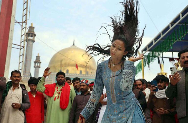 Devotees performing dhamal at the shrine of Hazrat Lal Shahbaz Qalandar ...