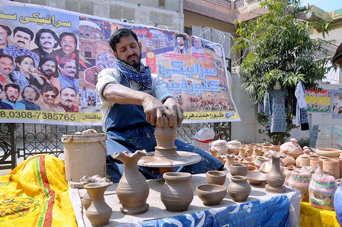 Saraiki people performing traditional dance Jhumar during celebrations ...