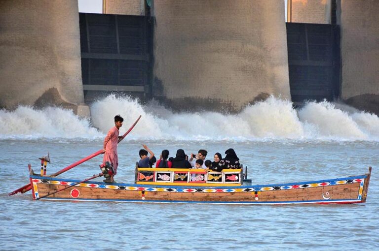 A family enjoying boat ride at Indus River.