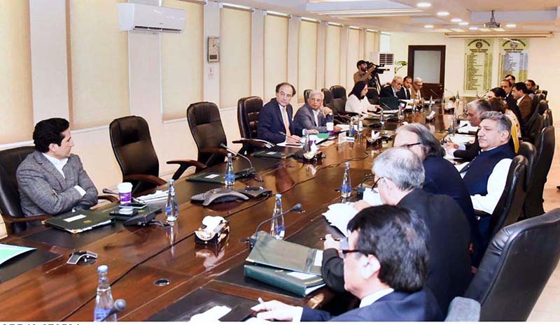 Federal Minister for Finance & Revenue Senator Muhammad Aurangzeb presiding over a meeting of ...