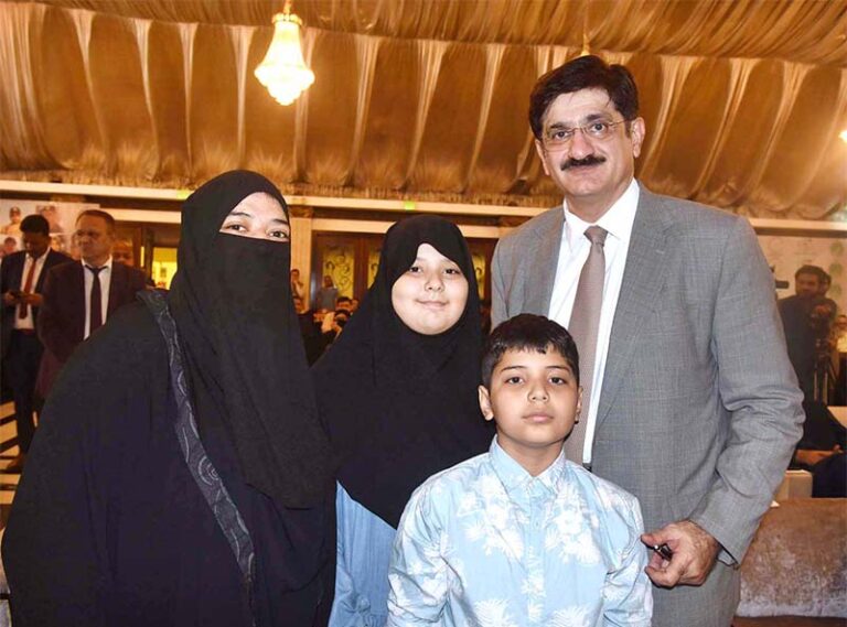 Sindh Chief Minister Syed Murad Ali Shah poses for a photo with the ...