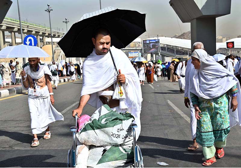 Hajj pilgrims throwing pebbles at three pillars that represent Satan at ...