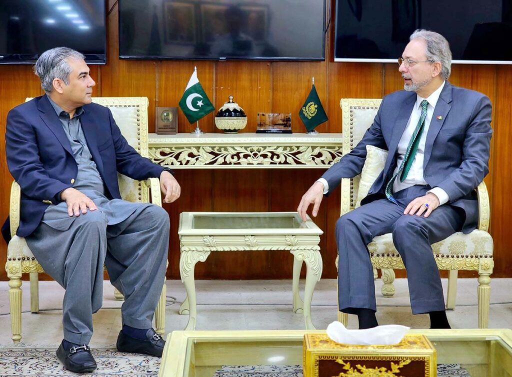 Interior Minister Mohsin Naqvi presenting a souvenir to the Ambassador ...