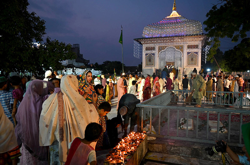 Malang (devotee) performing dhamal (sufi dance) at the shrine of Sufi ...