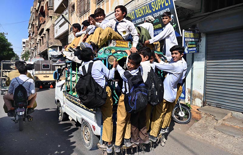 A view of overload school van as a large number of students traveling ...