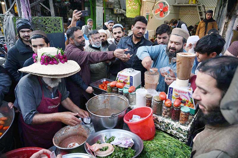 A large number of customers purchase traditional chatni (sauce) from ...